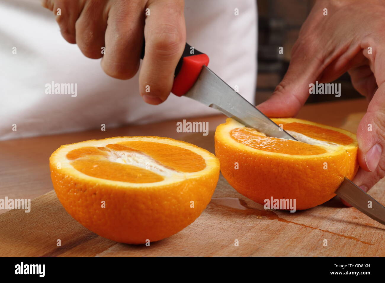 Cutting Orange into Pieces Stock Photo - Alamy