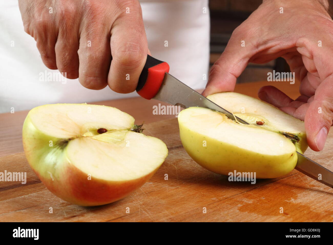 Cutting Apple into pieces Stock Photo - Alamy