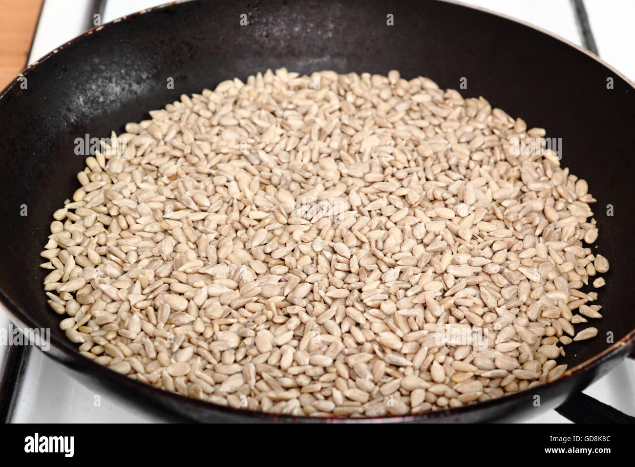 Frying sunflower seeds Stock Photo - Alamy