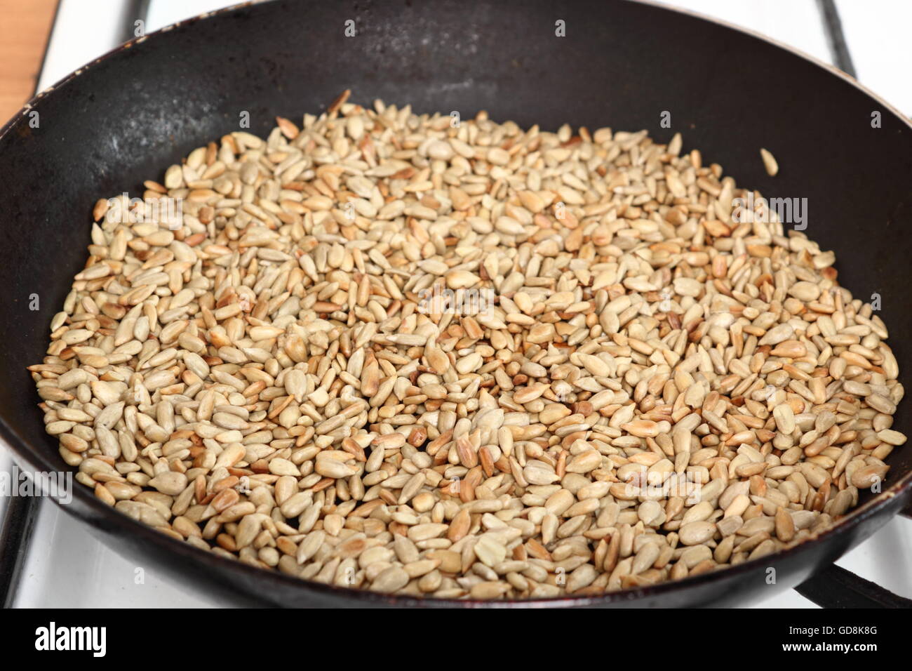 Frying sunflower seeds Stock Photo - Alamy