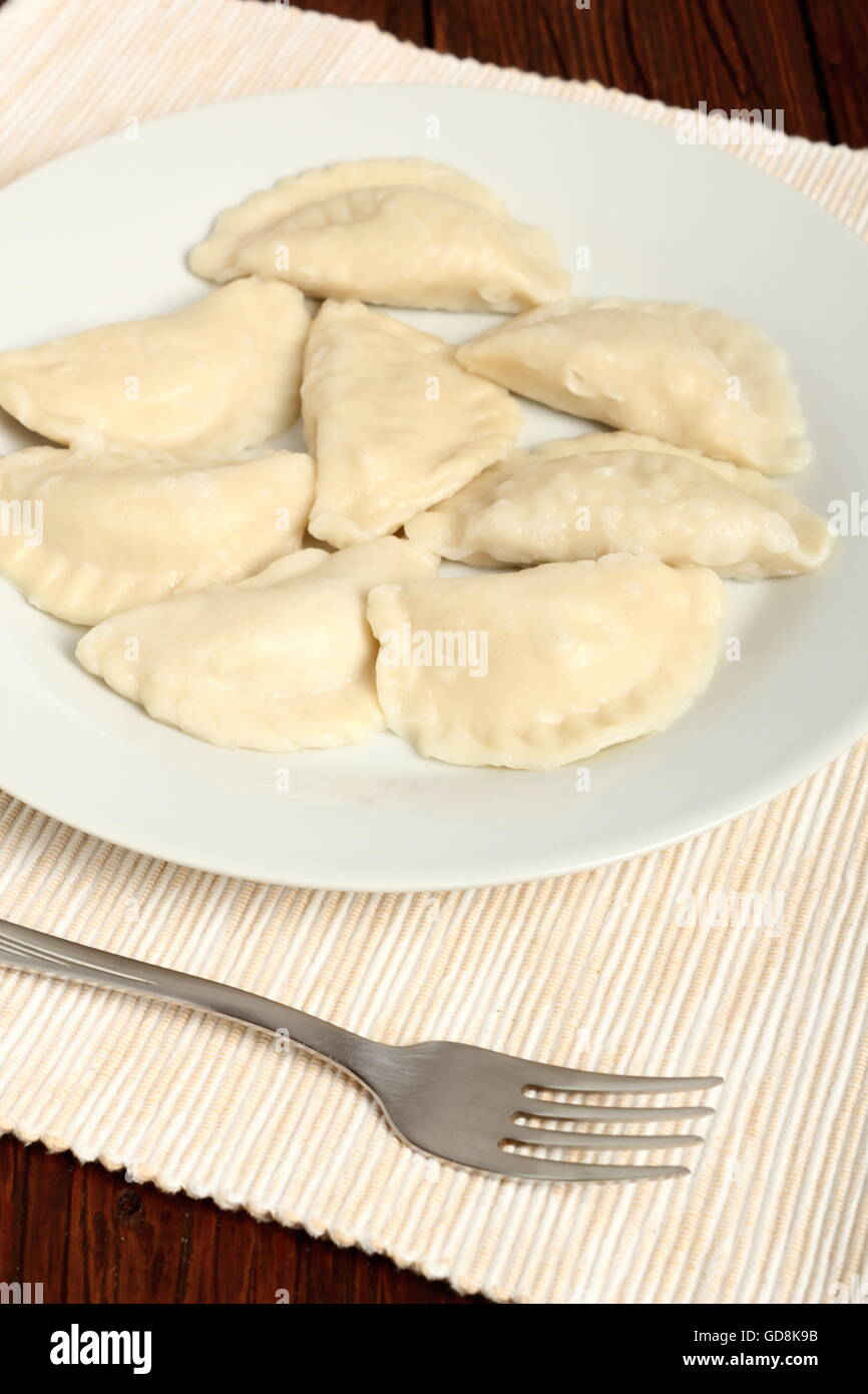 Cooked Dumplings on plate Stock Photo - Alamy