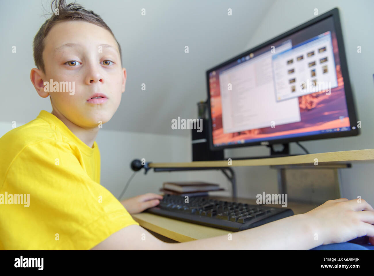 Boy working on computer in his room Stock Photo - Alamy