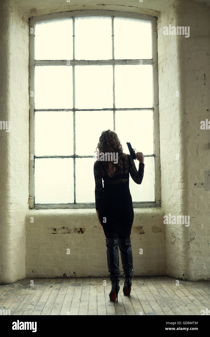 Woman gun rear view hi-res stock photography and images - Alamy