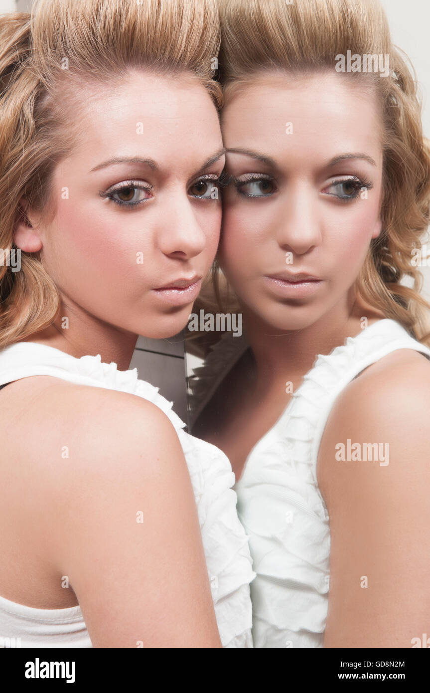 Woman's reflection in the mirror Stock Photo - Alamy
