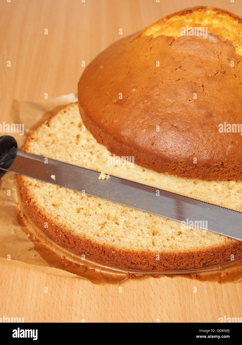 Cutting cake into layers. Making torte with buttercream filling and ...