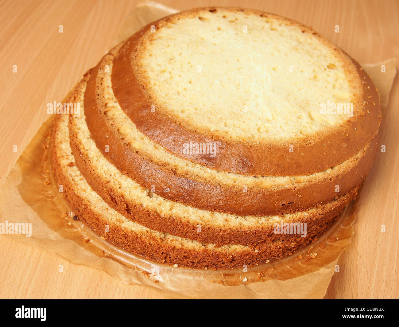Cutting cake into layers. Making torte with buttercream filling and ...