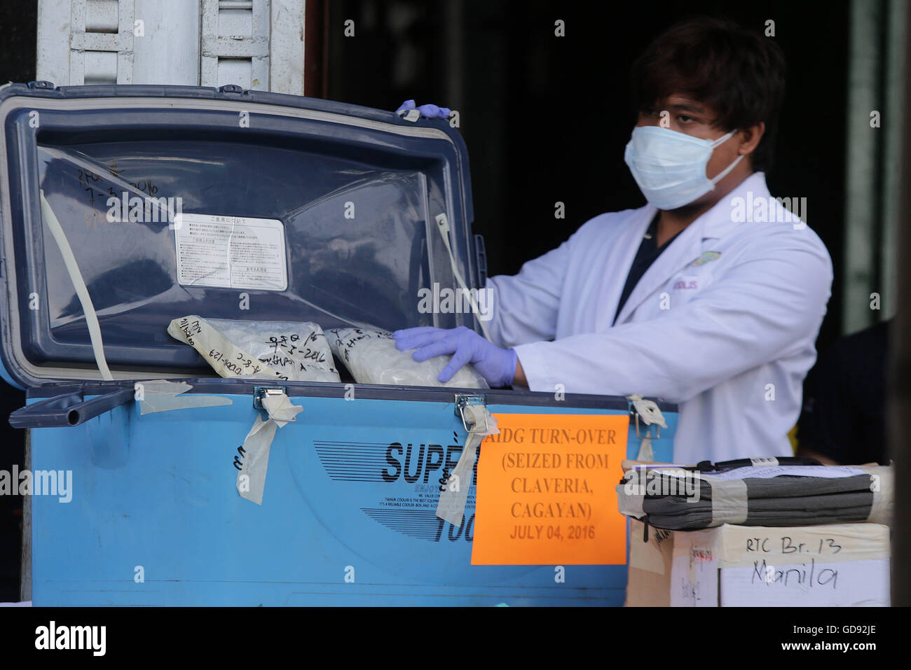 Cavite Province, Philippines. 14th July, 2016. A staff member of ...