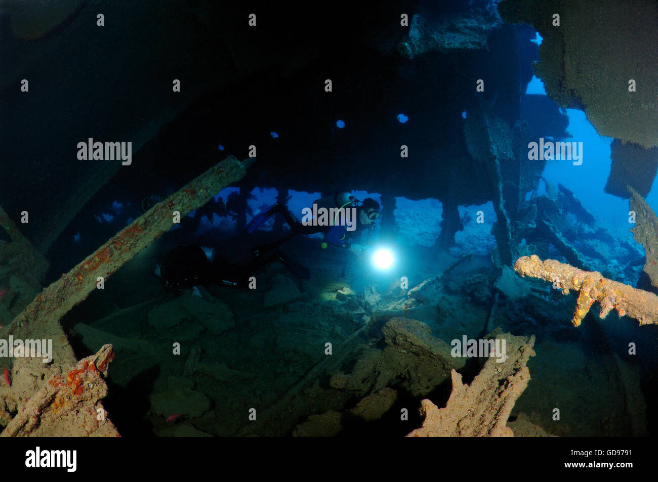 Male scuba diver inside the wreck of the SS Dunraven, Red Sea, Egypt ...