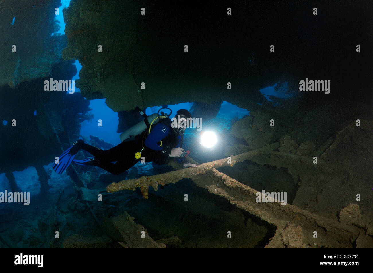 Male scuba diver inside the wreck of the SS Dunraven, Red Sea, Egypt ...