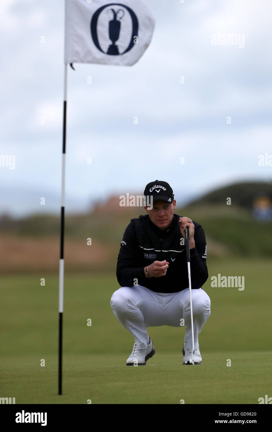 England's Danny Willett lines up a putt on the first tee during the ...