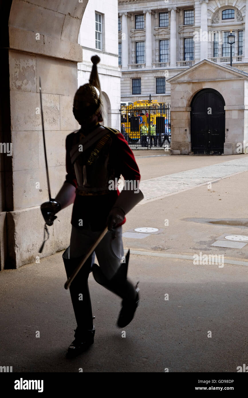 A dismounted guard of The Life Guards stands guard at the Horse Guards ...
