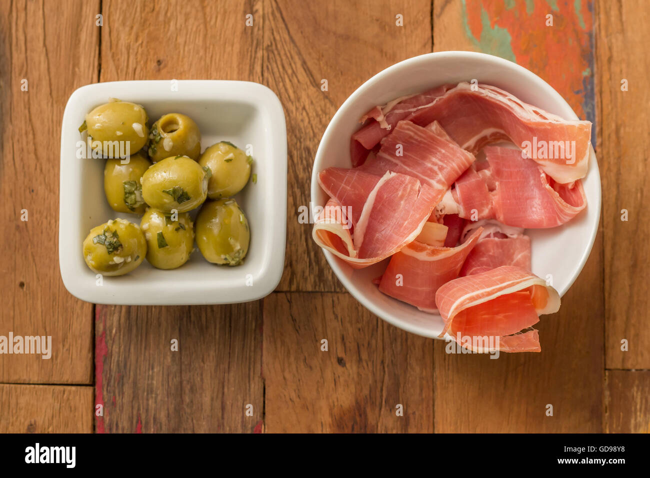 Typical Spanish tapas: serrano ham and marinated green olives Stock ...