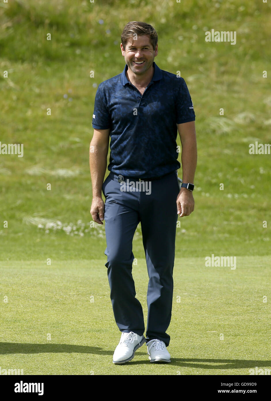 England's Robert Rock walks down the 5th fairway during the practice ...