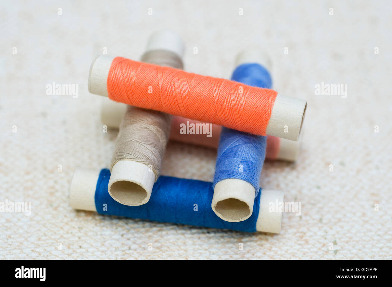 Pile of sewing thread spools hi-res stock photography and images - Alamy