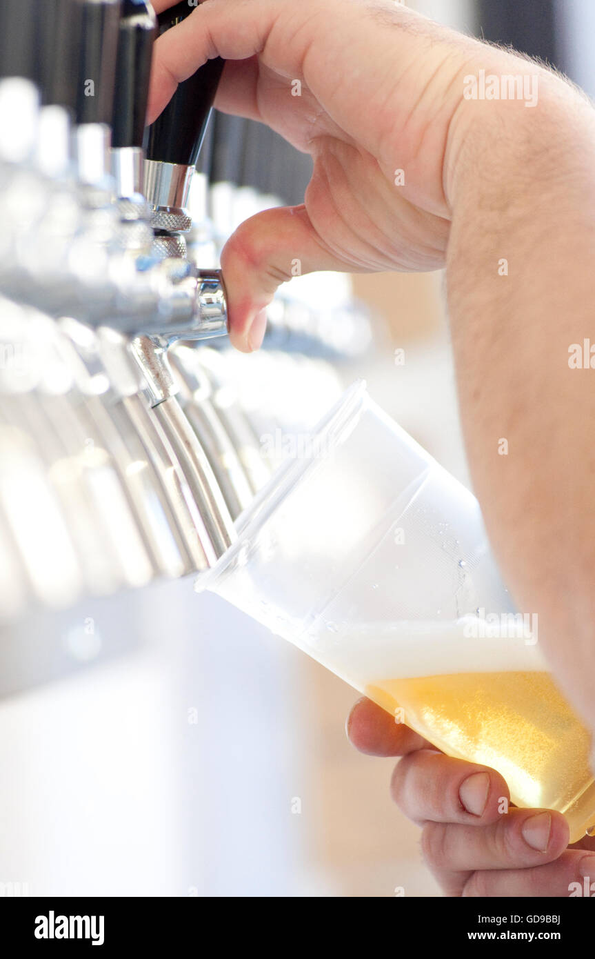 Man Filling a Glass of Beer Stock Photo - Alamy