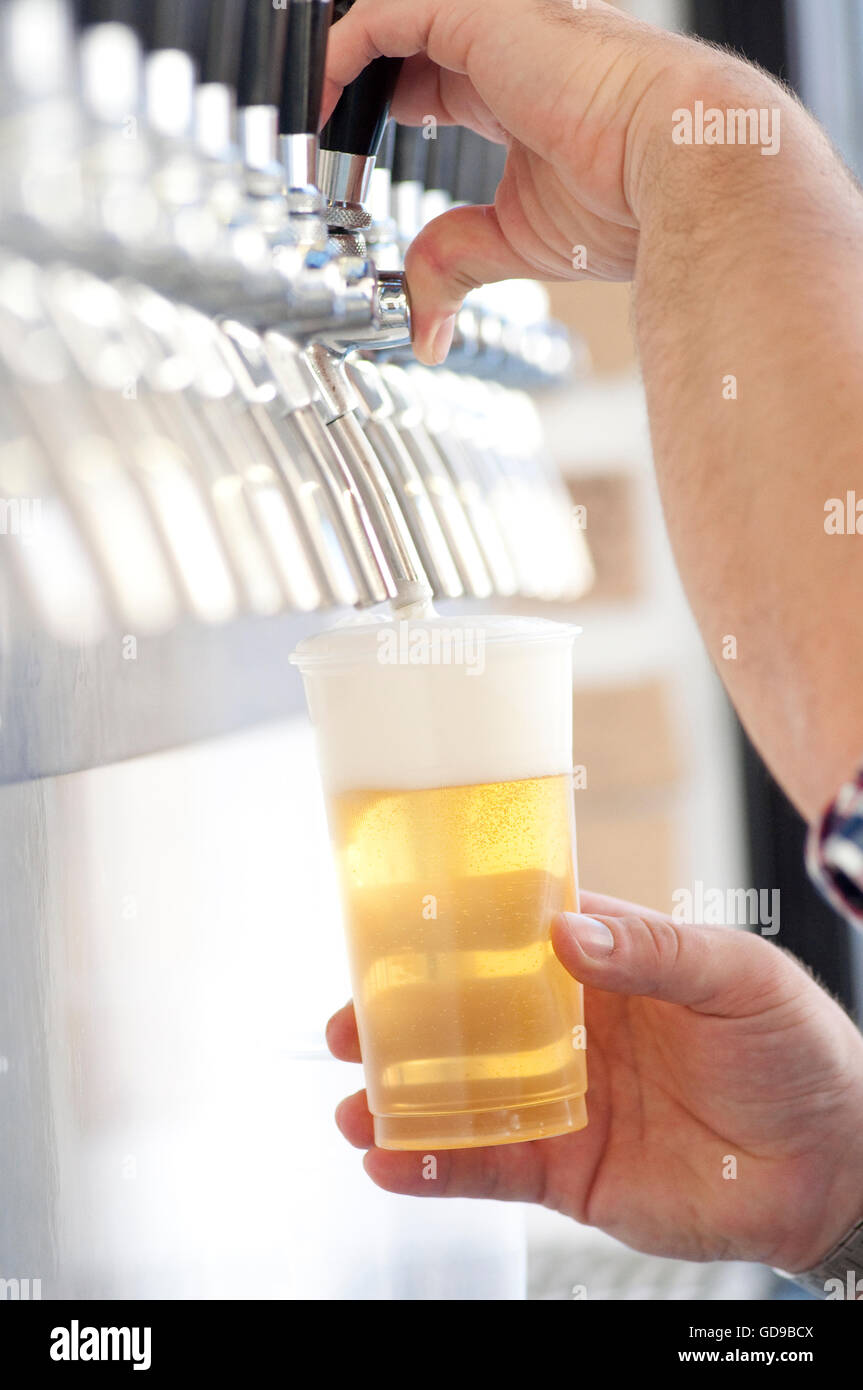 Man Filling a Glass of Beer Stock Photo - Alamy