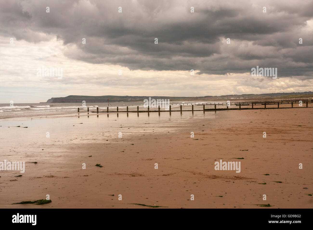 Dark clouds over the beach at Redcar on the north east coast of England ...
