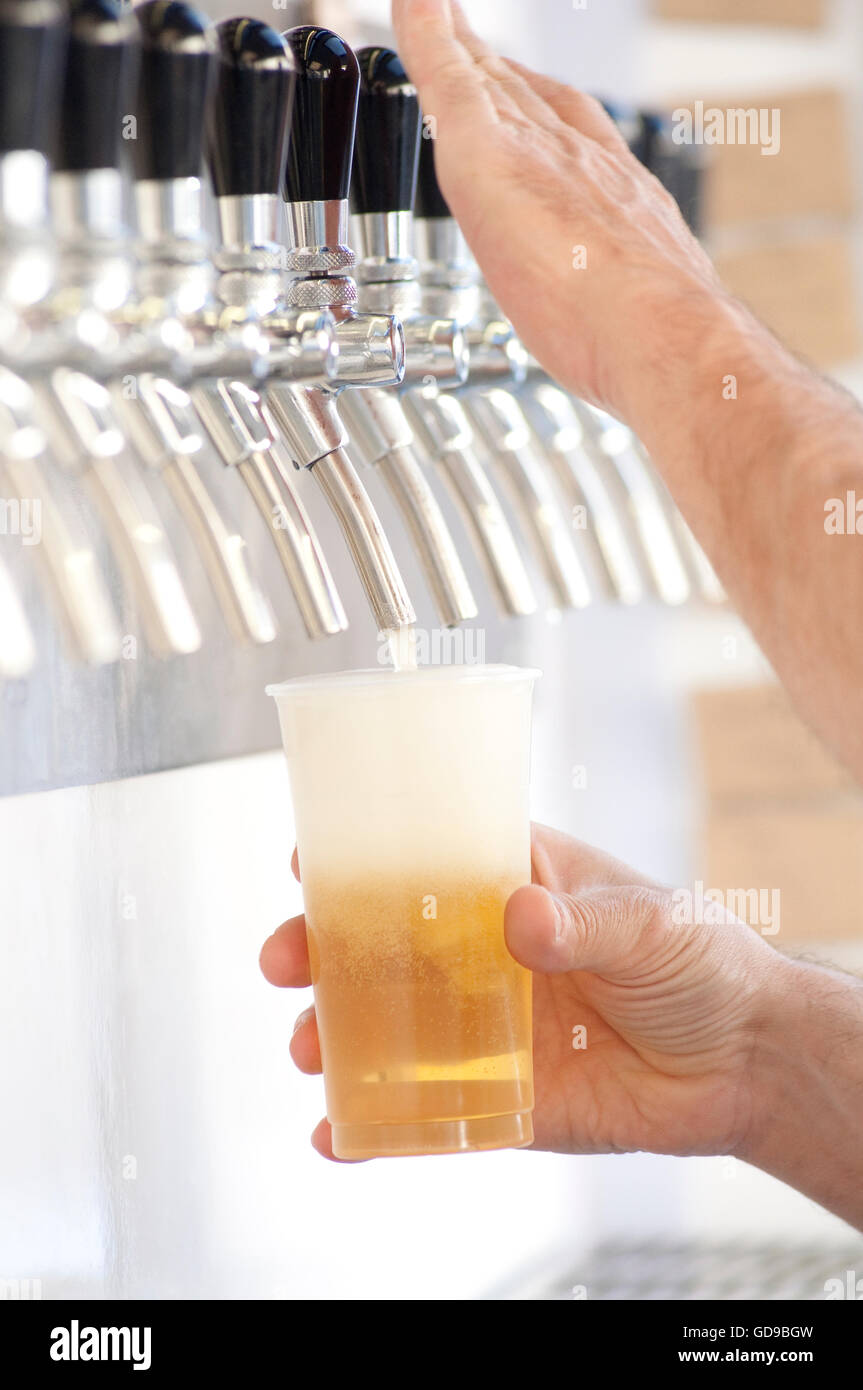 Man Filling a Glass of Beer Stock Photo - Alamy