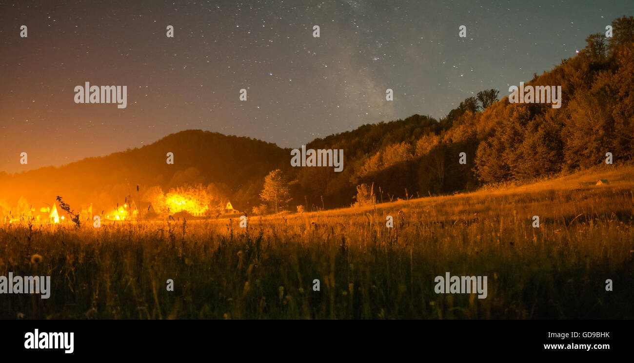 Lights spreading across the field at clear night Stock Photo - Alamy