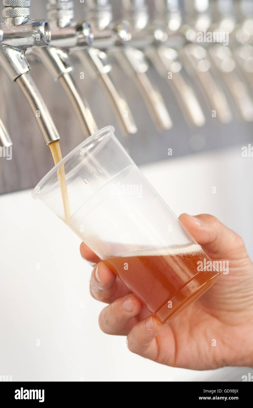 Man Filling a Glass of Beer Stock Photo - Alamy