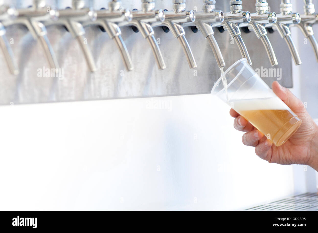 Man Filling a Glass of Beer Stock Photo - Alamy