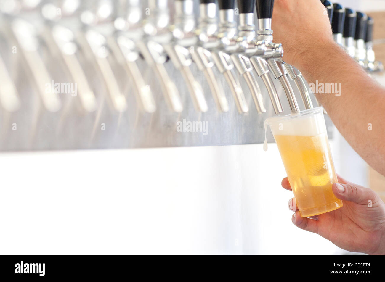 Man Filling a Glass of Beer Stock Photo - Alamy
