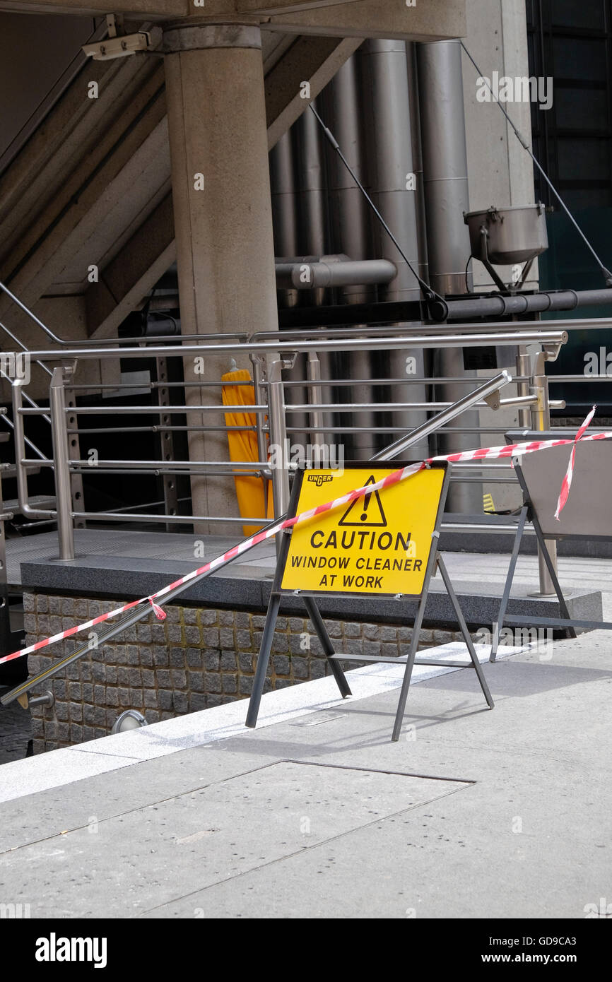 A caution sign warning of window cleaners being overhead Stock Photo ...