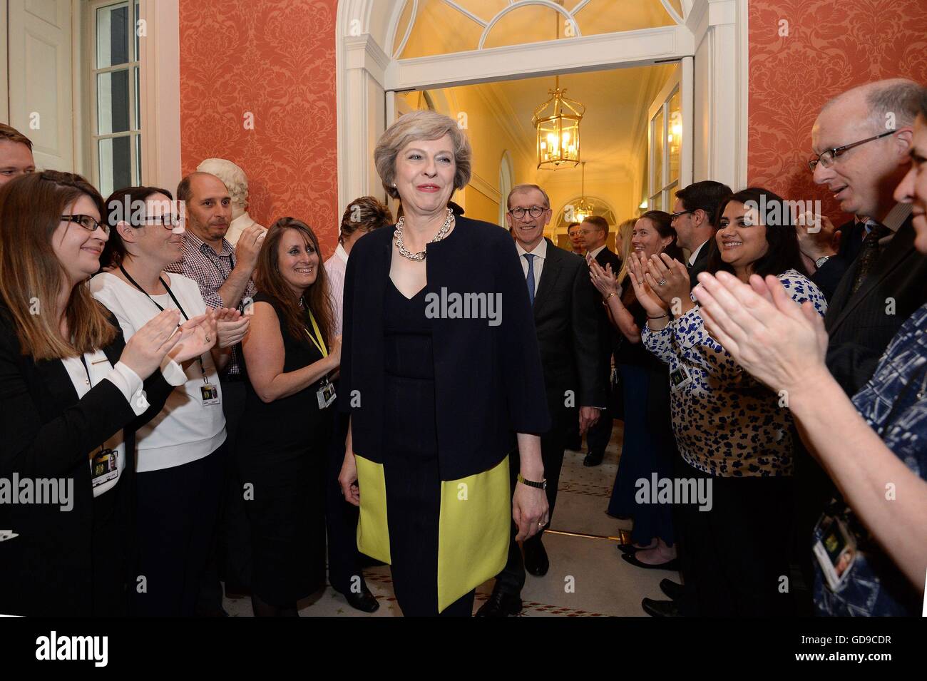 Staff clap as new Prime Minister Theresa May walks into 10 Downing ...