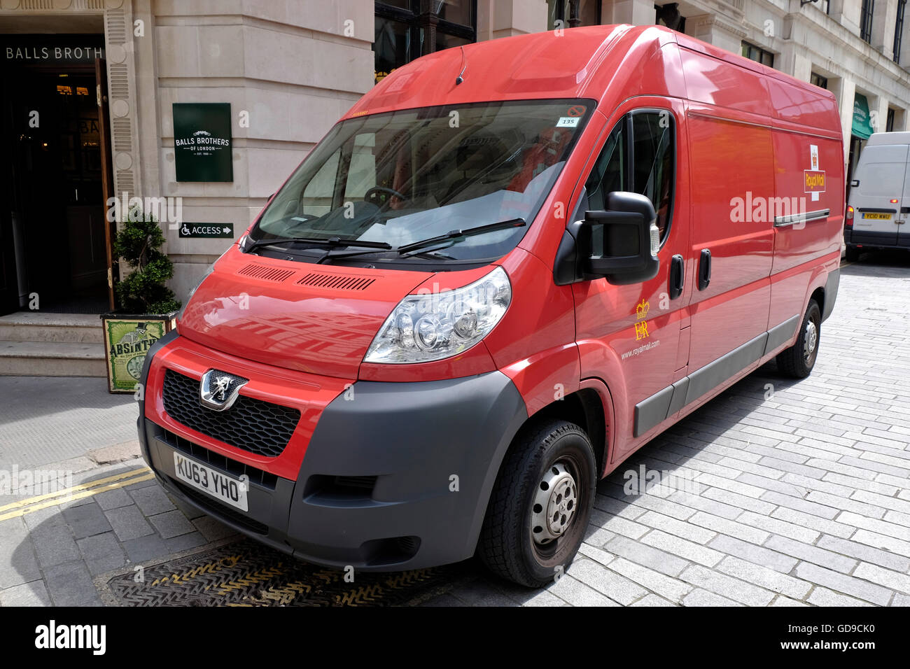 A Royal Mail delivery van parked in the street outside Balls Brothers ...