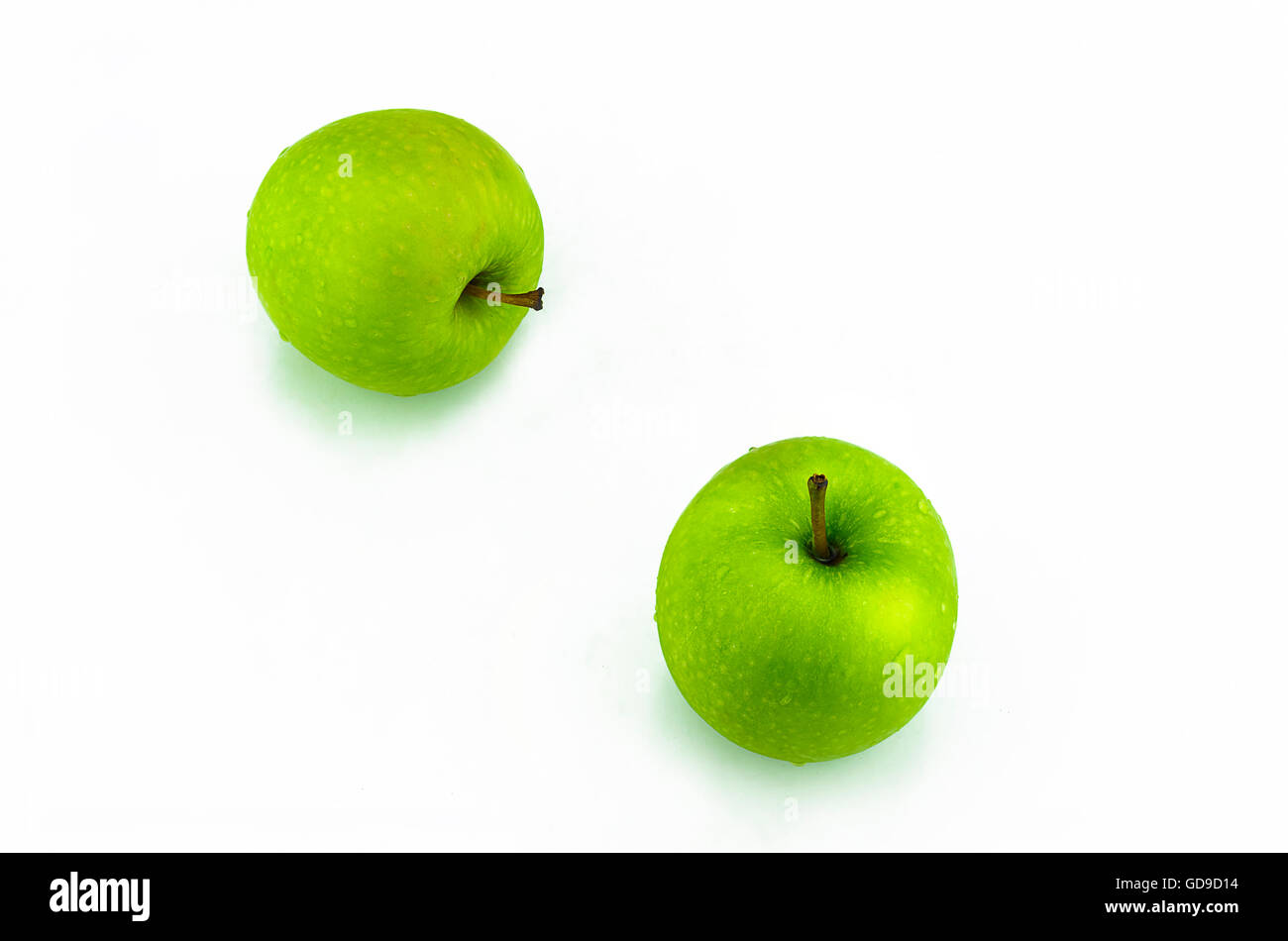 Green apple on white background Stock Photo - Alamy