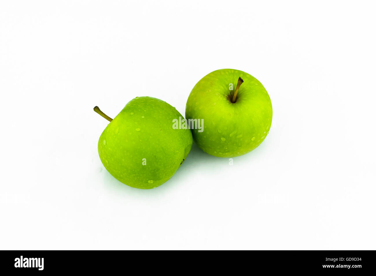 Green apple on white background Stock Photo - Alamy
