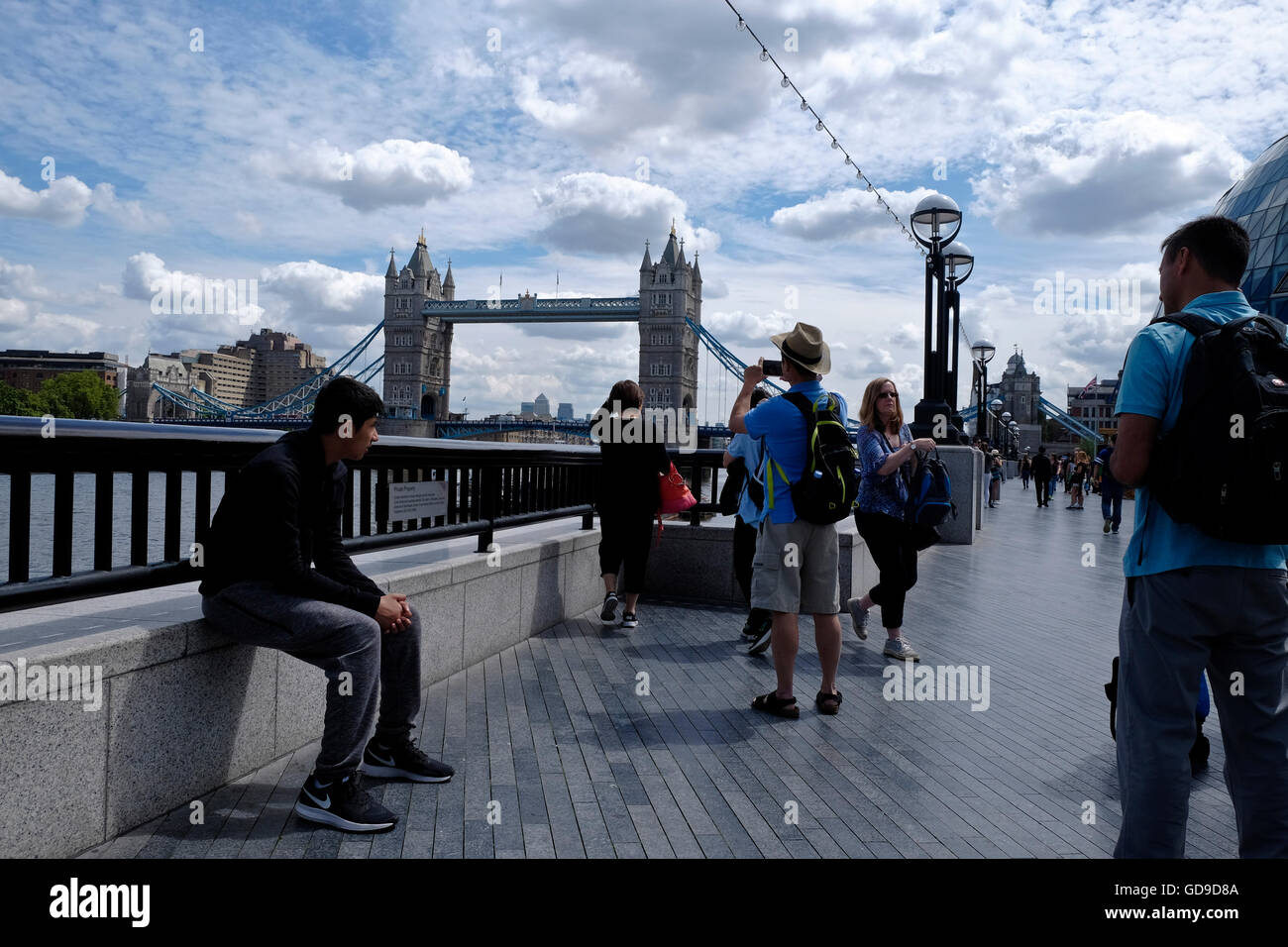 London, United Kingdom. Tourists pose for photographs on the South Bank ...