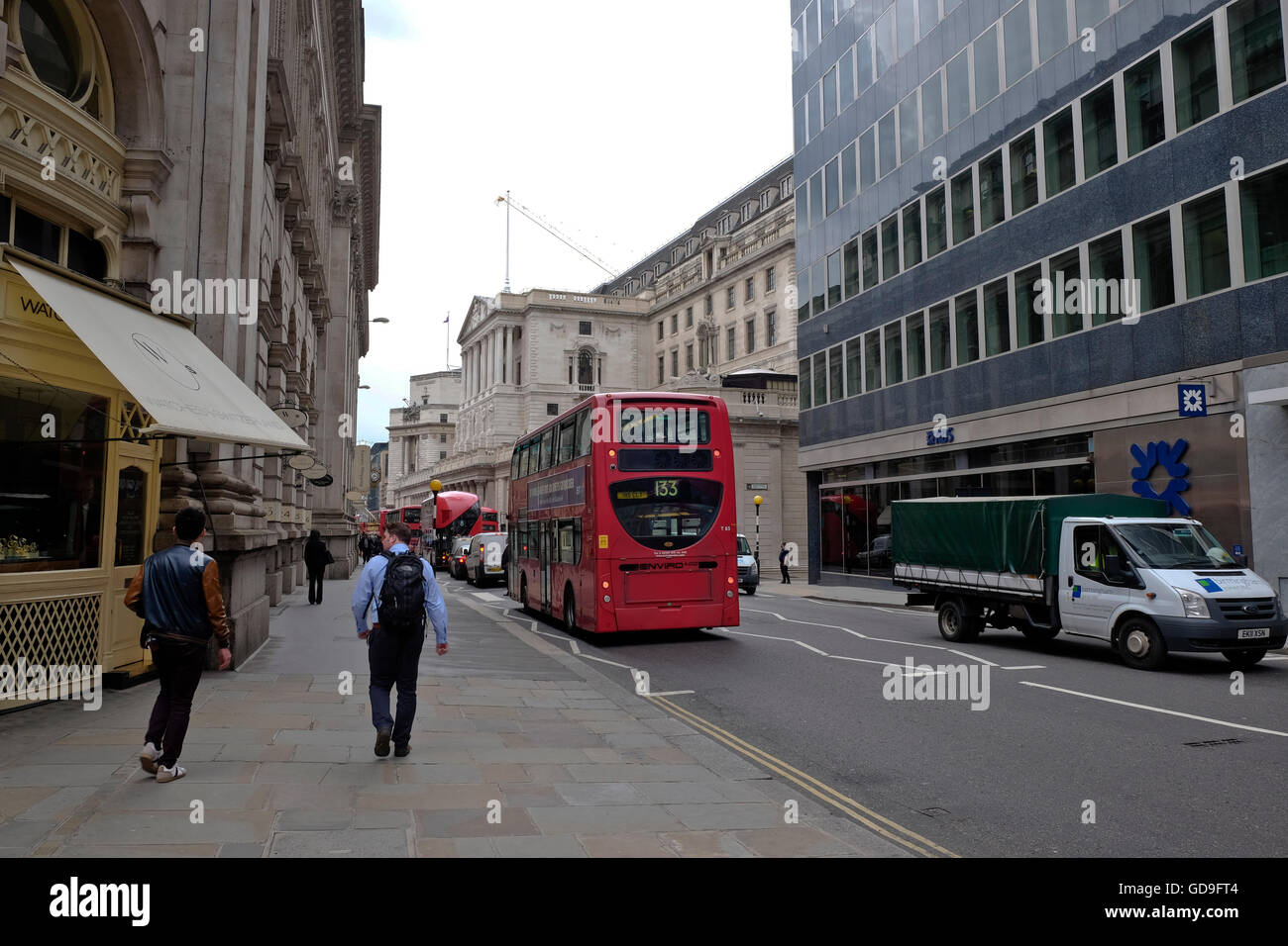 London, United Kingdom. Businessmen walk along Threadneedle street in ...