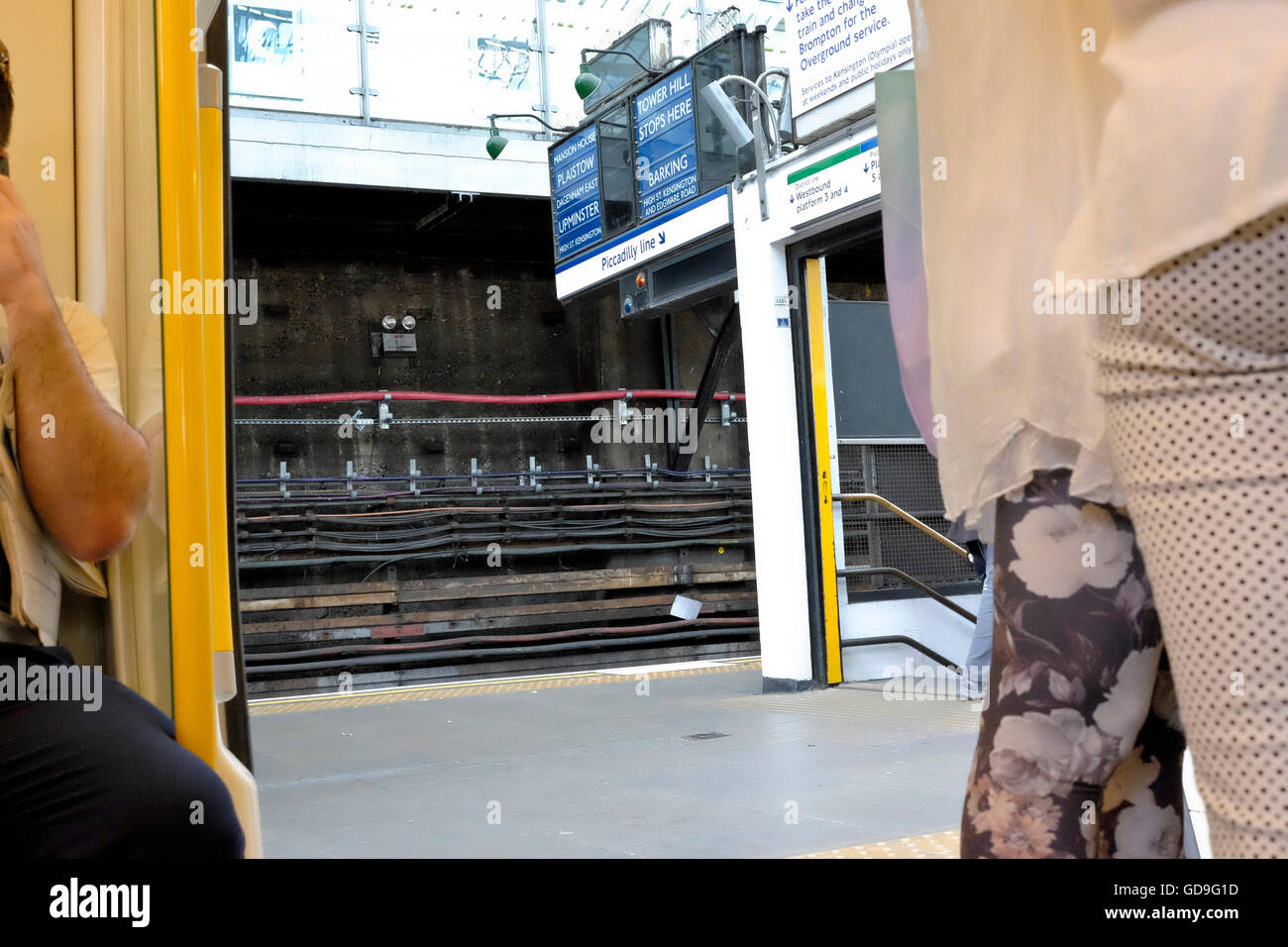 Underground station cabling through open train door Stock Photo - Alamy