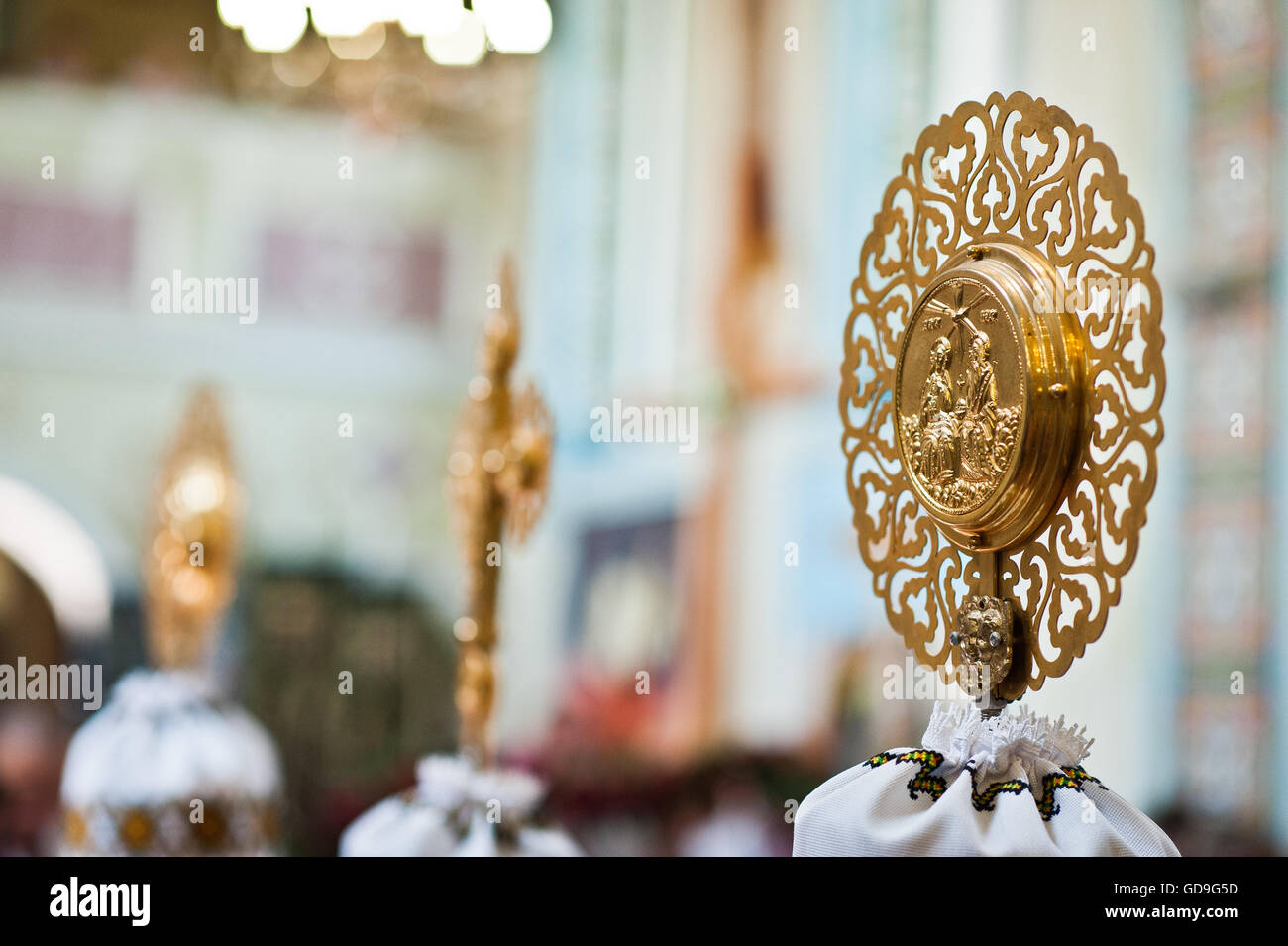 Golden cross with church element of stick throne at church Stock Photo ...