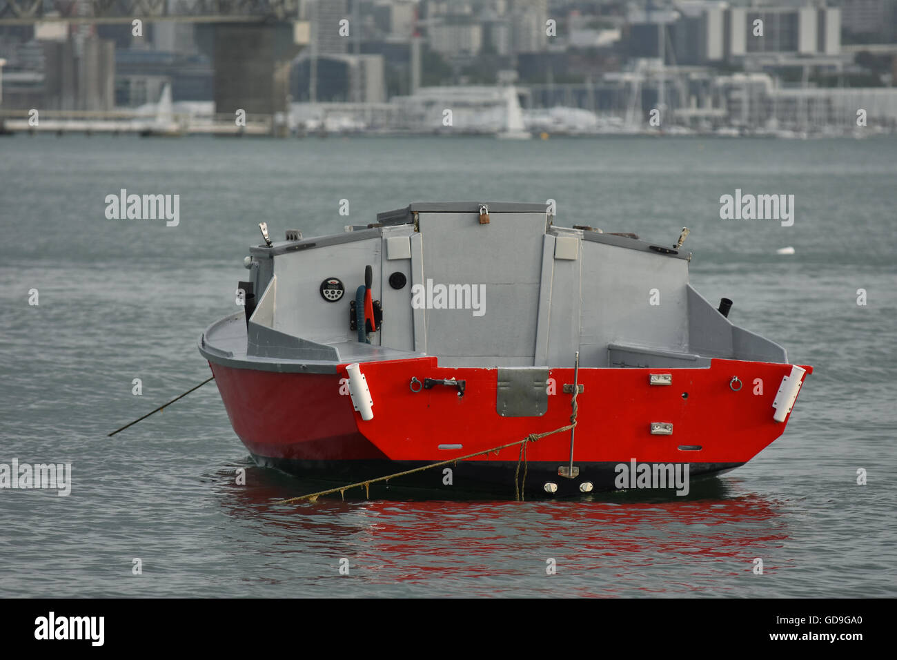 Small wooden sailing boat with bright red hull Stock Photo - Alamy