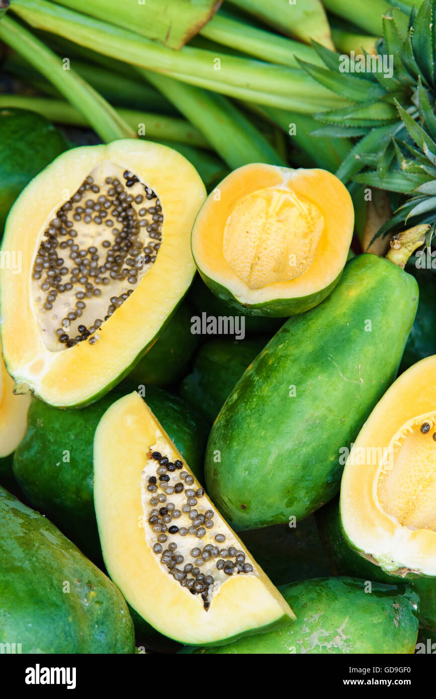 Asian street farmer market selling fresh papaya in Vietnam. Green and ...