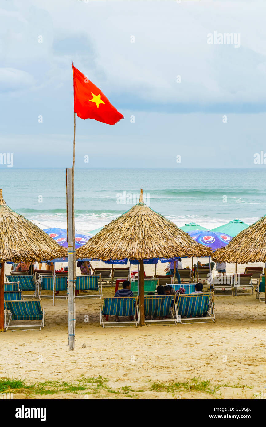Da Nang, Vietnam - February 20, 2016: People lying on sunbeds in the ...