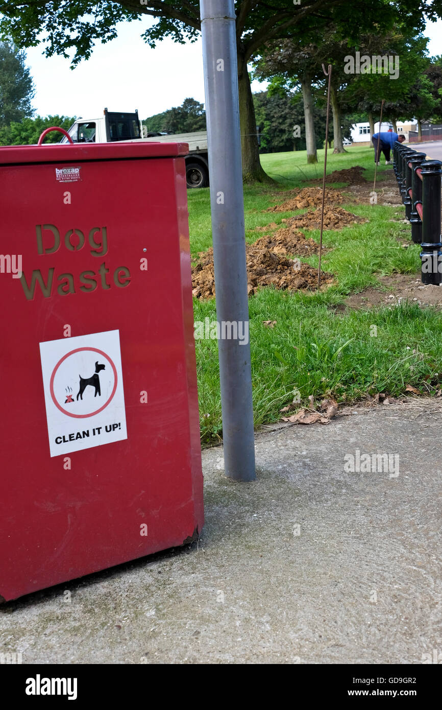 Dog waste bins are provided in public places for the disposal of dog ...