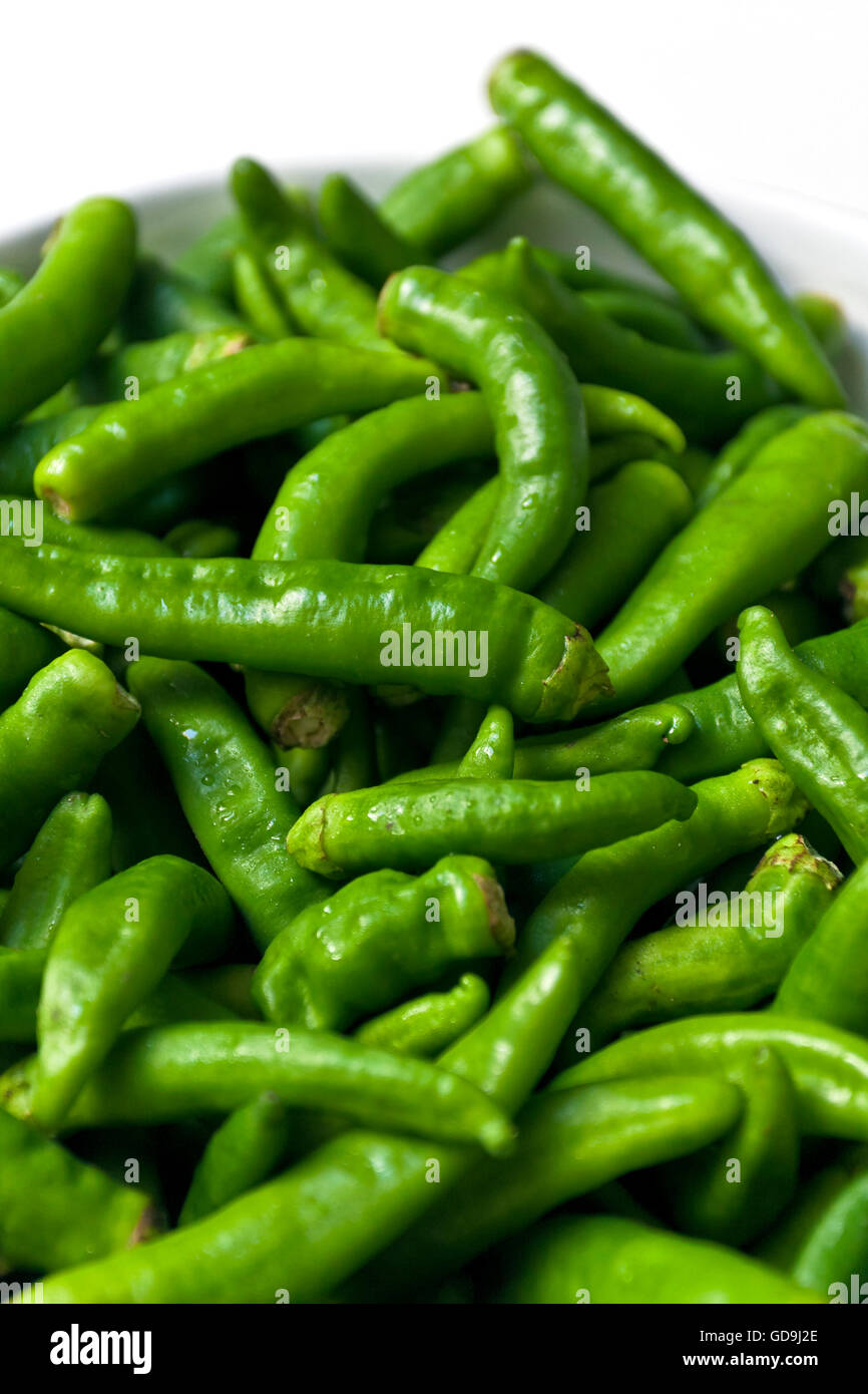 Fresh green chili peppers Stock Photo - Alamy