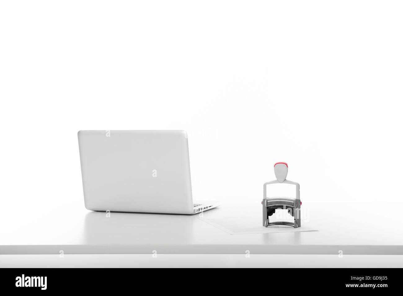 Laptop and stamp on desk Stock Photo - Alamy