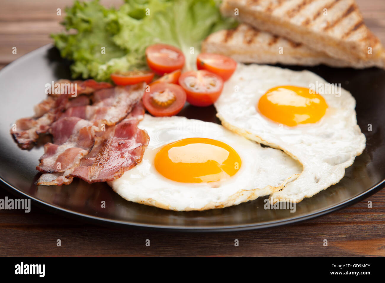 Traditional breakfast on a plate Stock Photo - Alamy