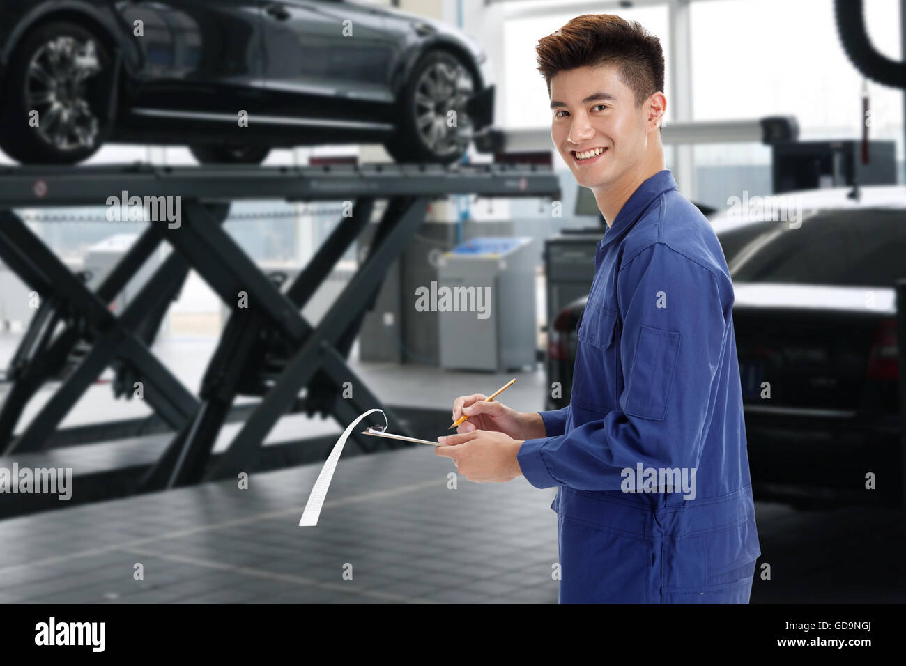 Car repair workers at work Stock Photo - Alamy