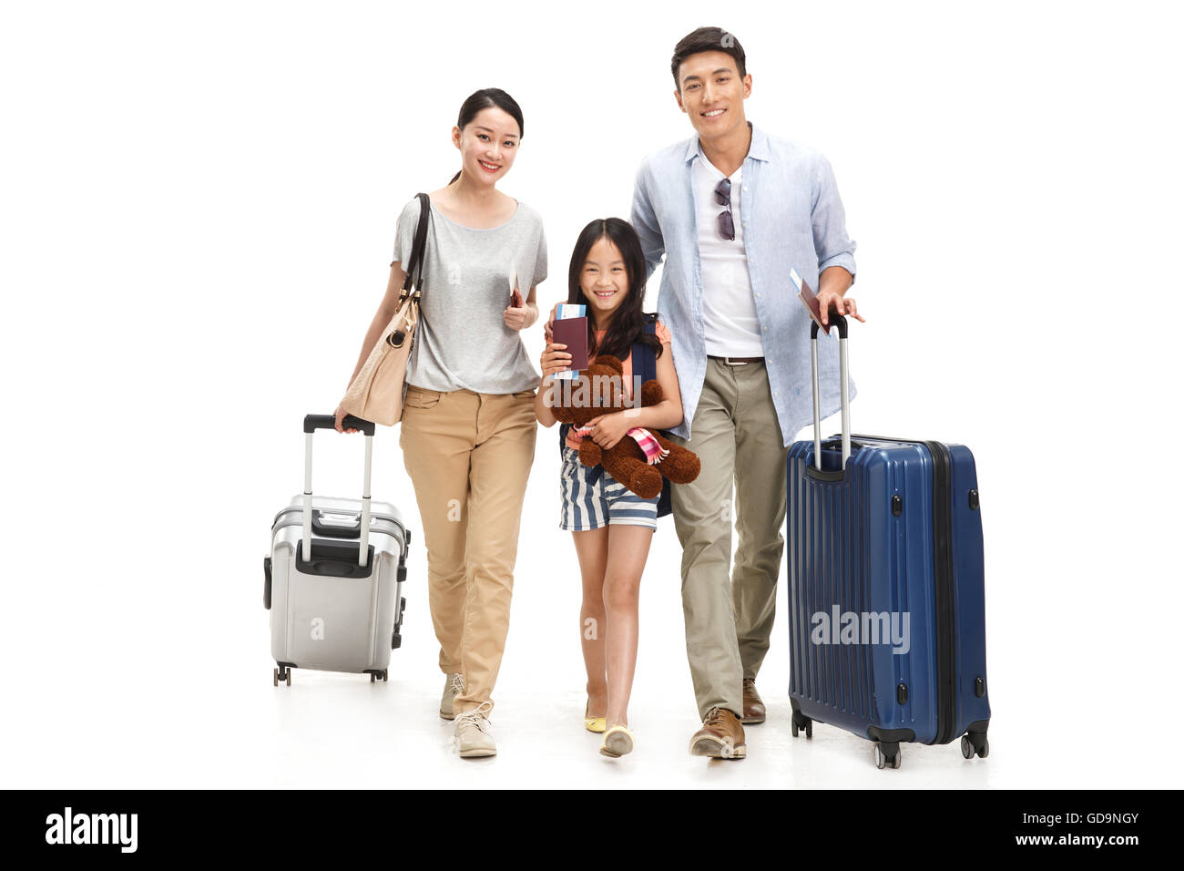 A family of three happy travel Stock Photo - Alamy
