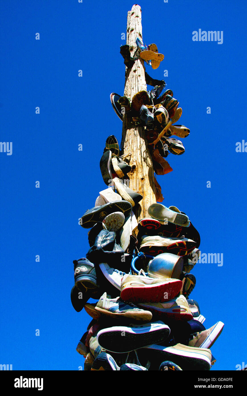 Many Shoes hanging from a telephone pole Stock Photo - Alamy