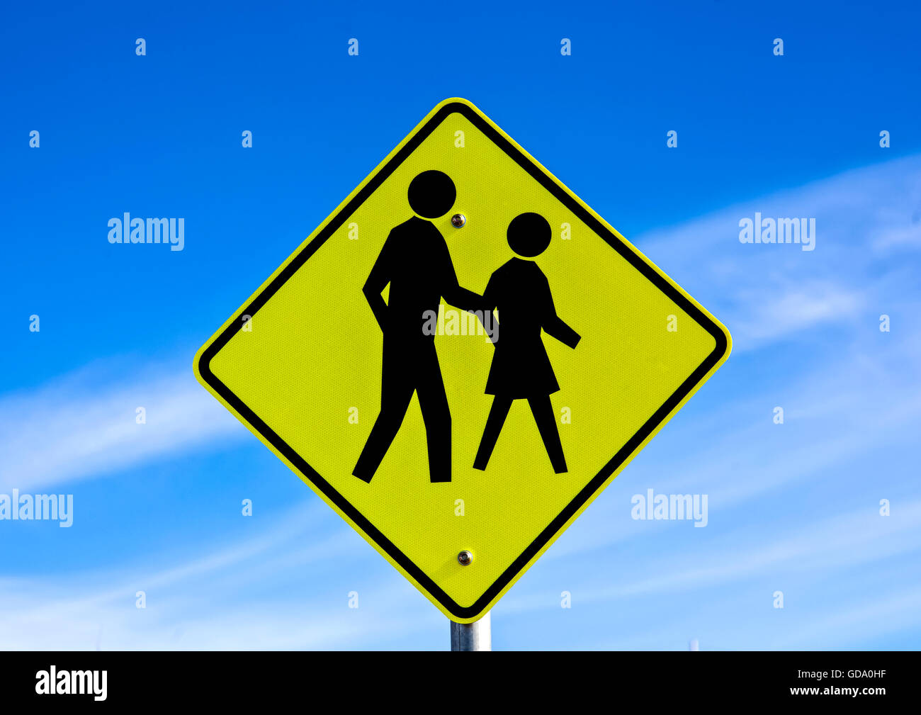 Road sign people crossing Stock Photo - Alamy