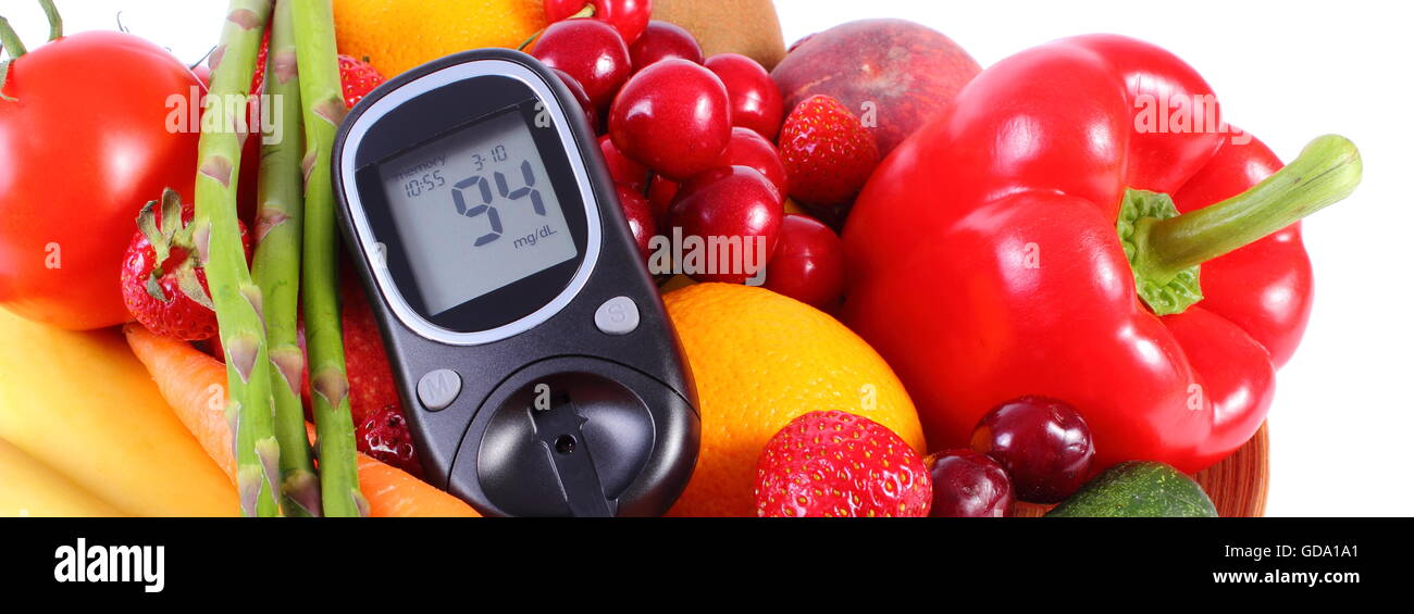 Glucometer with fresh ripe fruits and vegetables, concept of diabetes ...