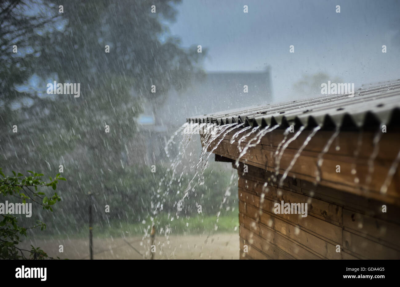 rain streams flowing from the roof Stock Photo - Alamy