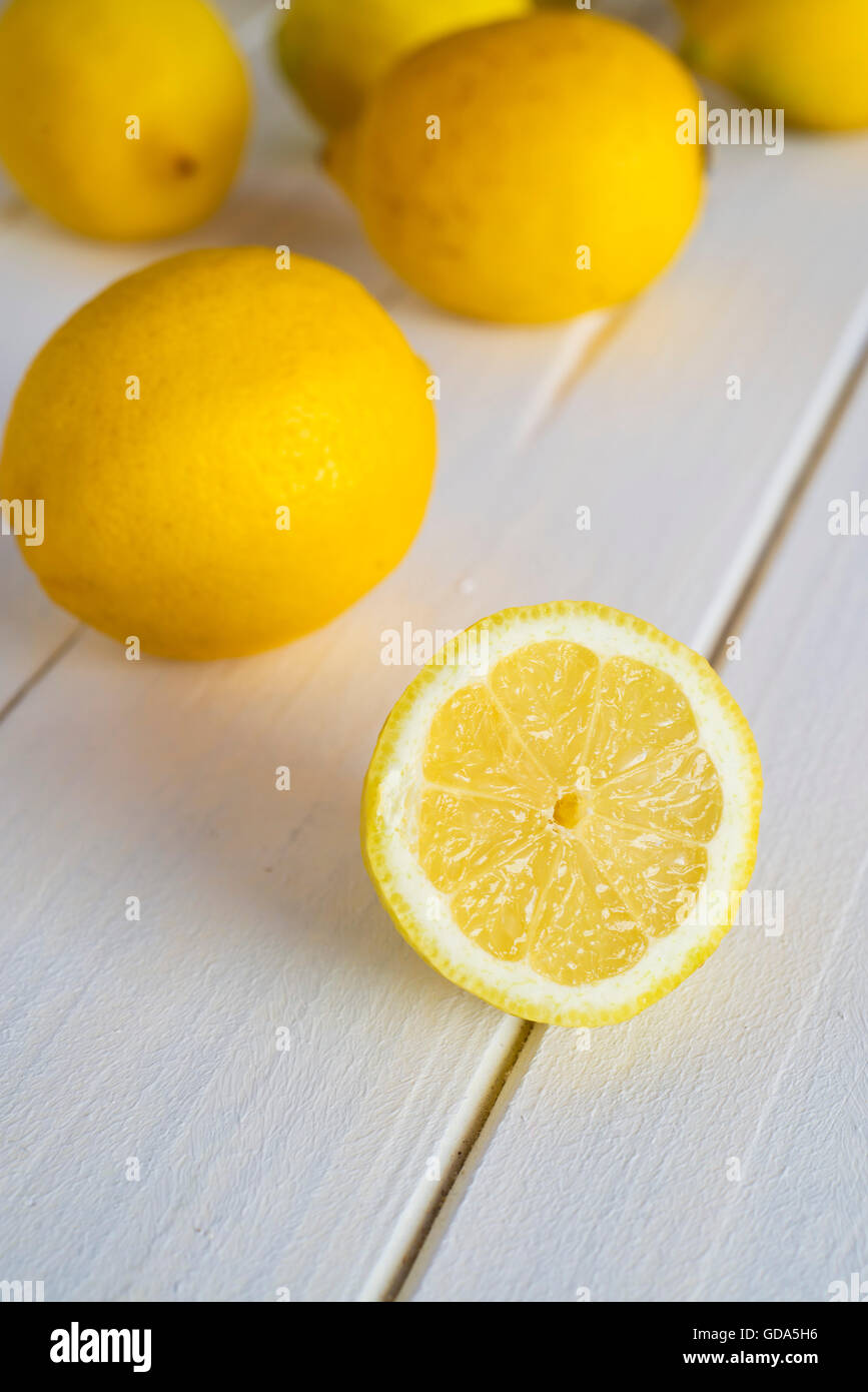 Fresh lemons on wooden background Stock Photo - Alamy