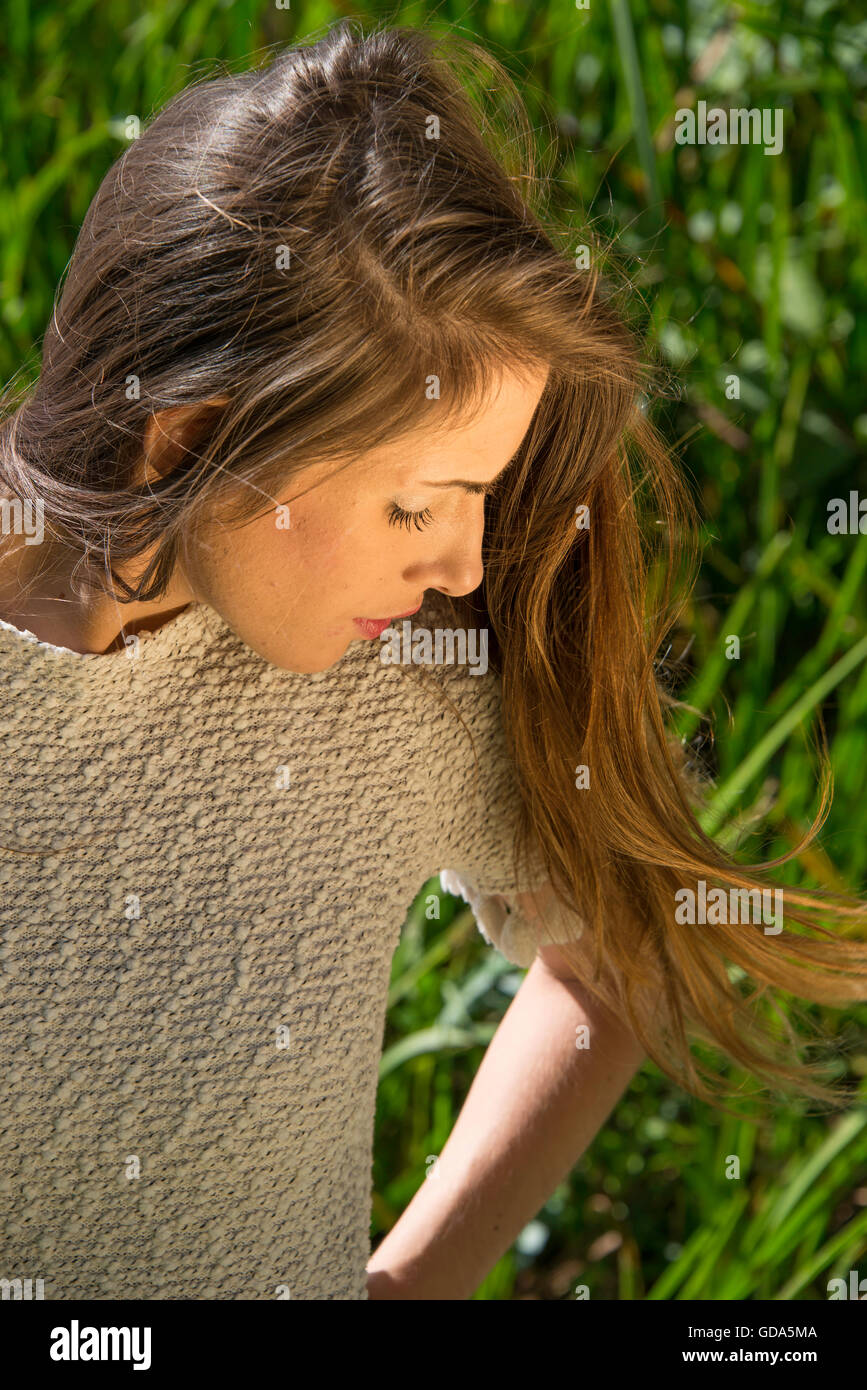 Young female model (20's) on photo shoot by river, Colnbrook, Berkshire ...